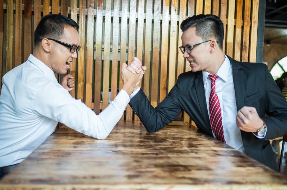 The High Stakes Of Rivalries At Work