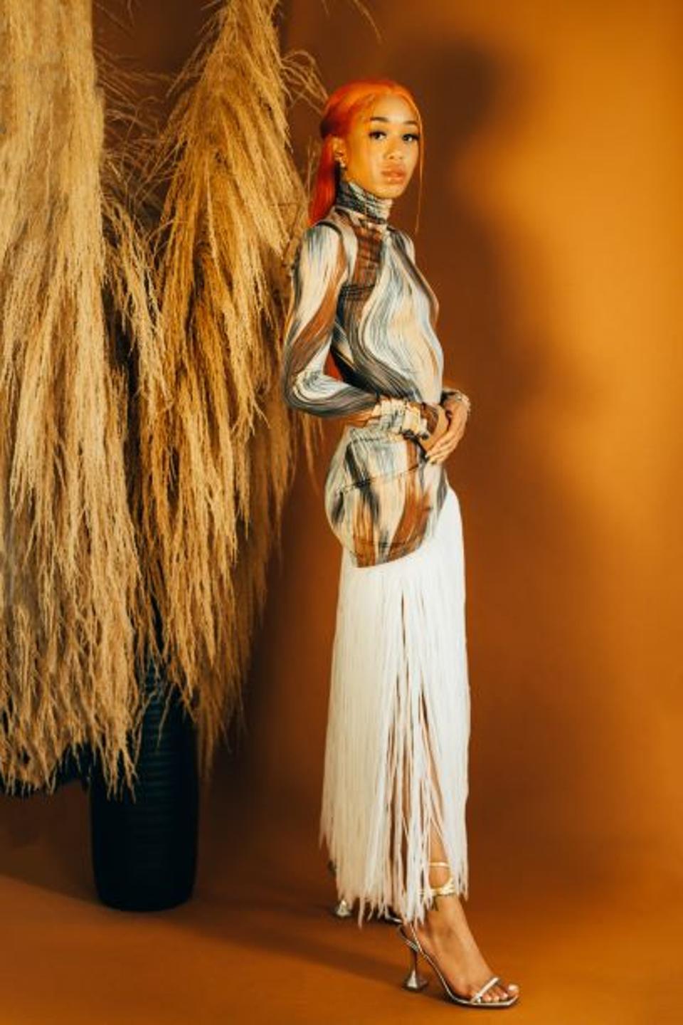 How Producer Kitty Ca$h Is Addressing Topics Like Financial Literacy ...