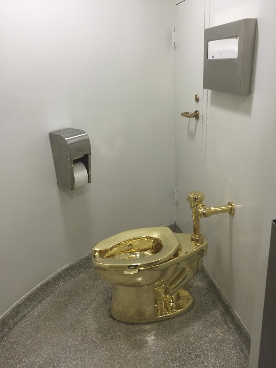 Maurizio Cattelan's 18-Karat Gold Toilet Unveiled at The Guggenheim Museum