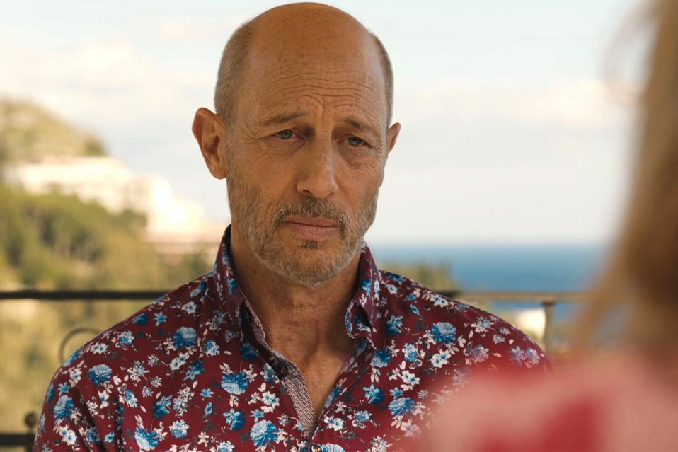 ‘The White Lotus’ Universe Gets A Supervillain: The Greg Conspiracy